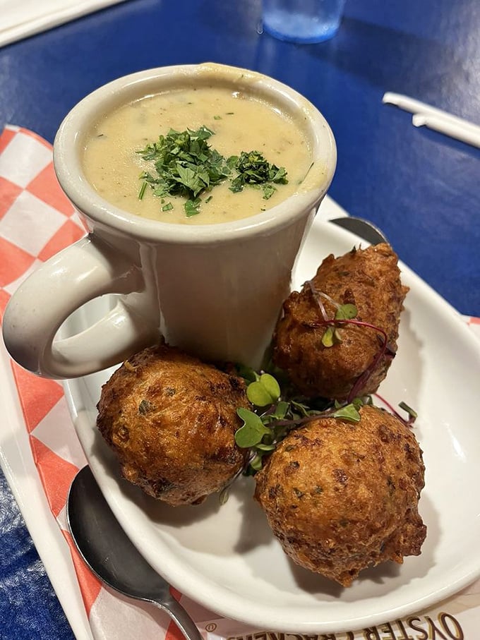 A mug of creamy clam chowder alongside golden hush puppies&mdash;the New England-Florida alliance we didn't know we needed but can't live without.