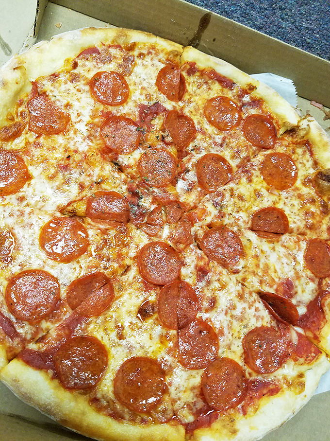 Classic pepperoni pizza done right, with cheese stretches that would make any Instagram food photographer weep with joy.