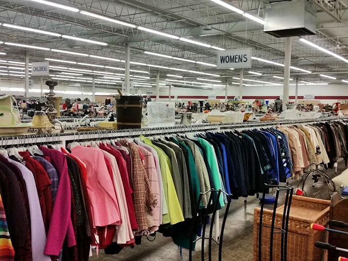 The women's clothing section stretches toward the horizon like a rainbow of fashion possibilities. Yesterday's trends await their comeback moment.