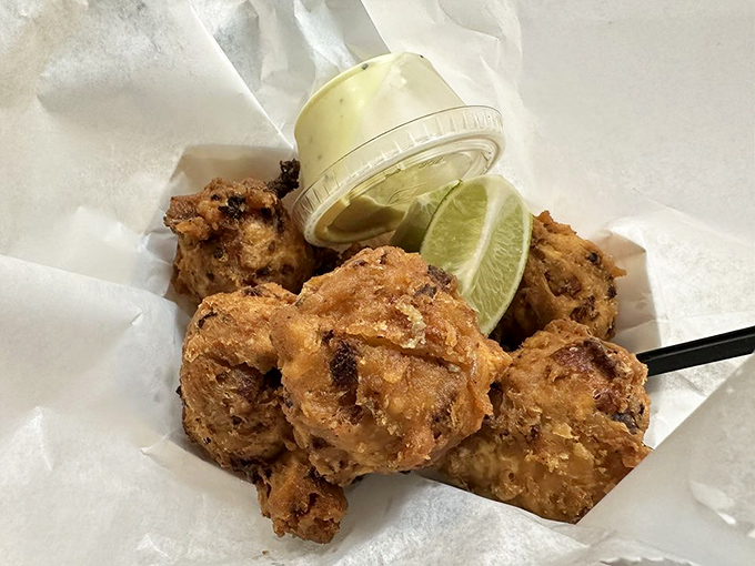 Golden, crispy perfection – these conch fritters could make even a vegetarian question their life choices.