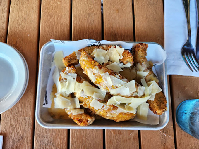 Parmesan-dusted corn "ribs" elevate the humble cob to gourmet status, proving vegetables can have fun too.