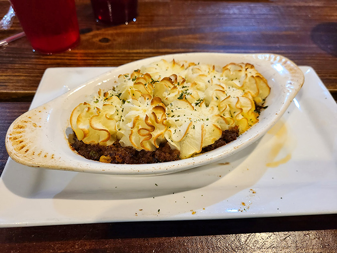 Cottage pie with those perfectly piped potato peaks&mdash;like delicious little mountains protecting a savory treasure of meat below.