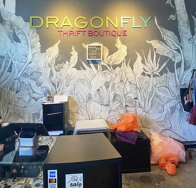 The checkout area features an artistic botanical mural that transforms a simple transaction into a moment of zen&mdash;retail therapy meets actual therapy.