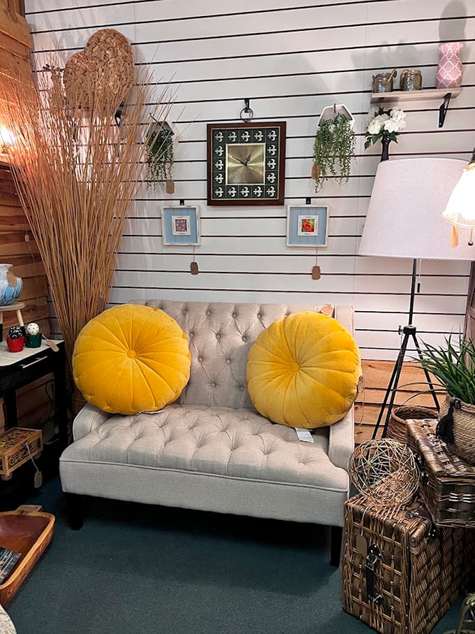 A tufted loveseat with sunshine-yellow pillows creates the perfect "try before you buy" spot when your feet need a shopping intermission.