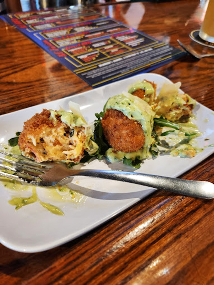 Crab balls that could make Baltimore jealous, perched on a bed of greens like culinary jewels. The fork is already plotting its next move.