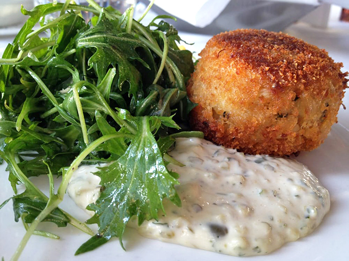 A perfectly golden crab cake that doesn't hide behind fillers&mdash;like that friend who always tells you the honest truth, but deliciously.