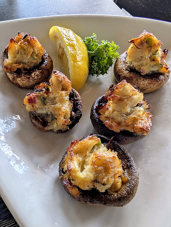 These stuffed mushies (as the locals call them) are what happens when mushroom caps meet crabmeat in a beautiful relationship blessed with cheese.