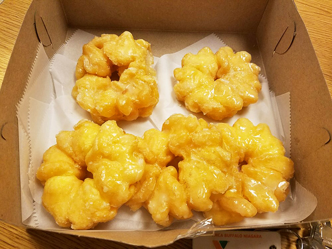 Golden crullers that shatter at first bite, then melt like butter. The kind of donut that ruins all other breakfast options.
