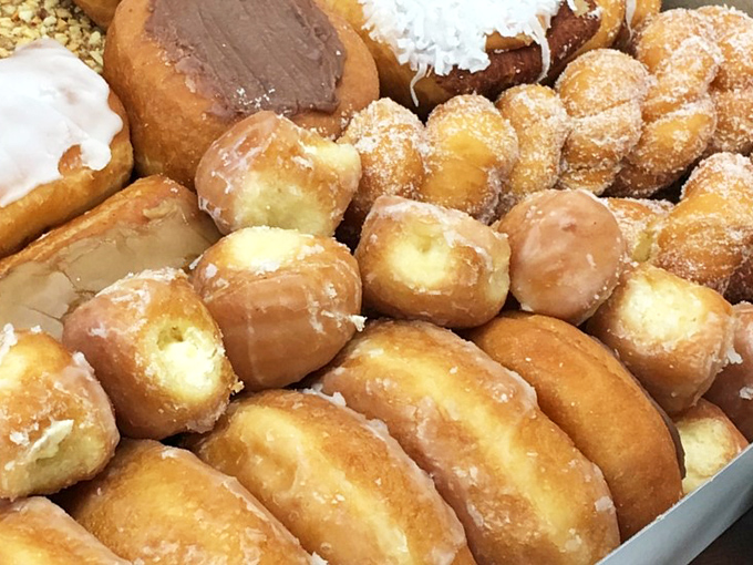 Donut nirvana exists, and it's found in these golden-fried pillows of joy. The glazed beauties huddle together like old friends at a delicious reunion.