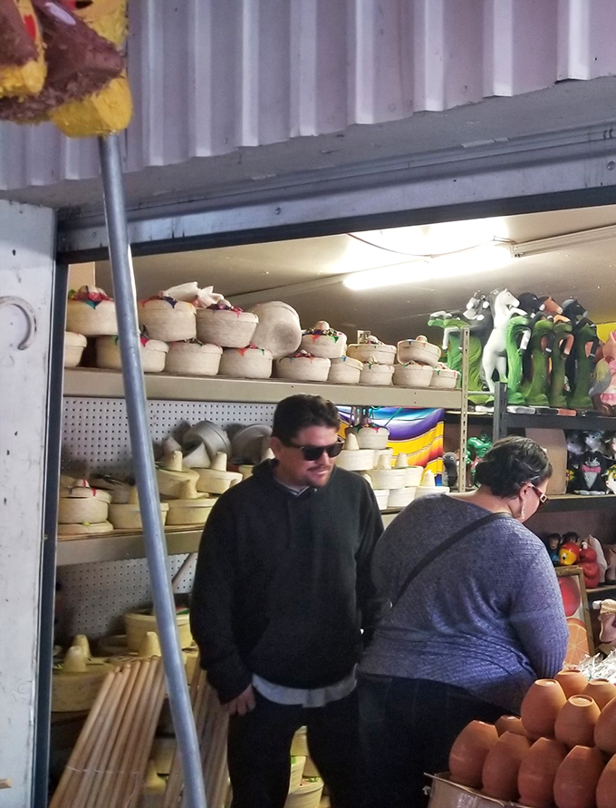 Handcrafted pottery awaits its forever home, stacked with the kind of care that says "I was made with love, not in a factory."