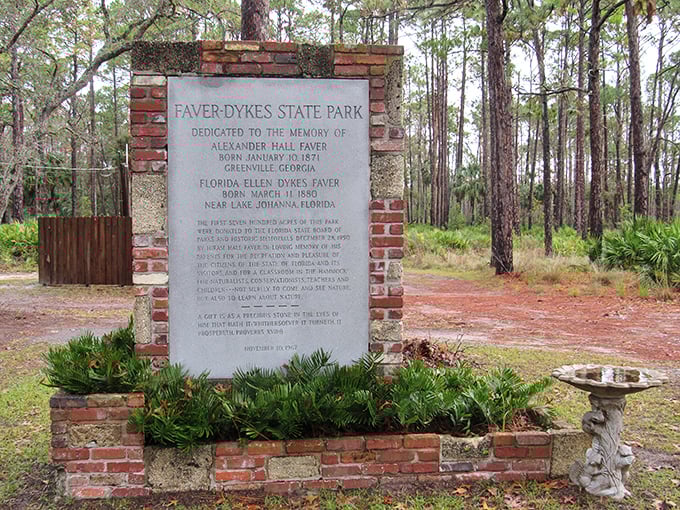 History set in stone. This dedication marker tells the story behind the name, reminding us that even wilderness has human connections worth preserving.