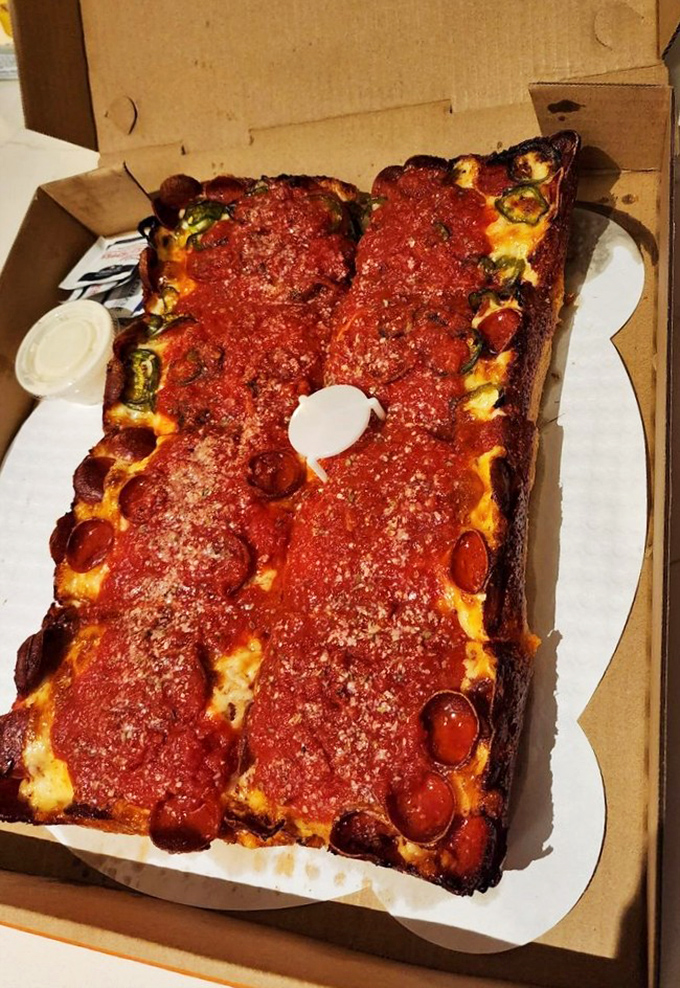 Look at those crispy, caramelized edges! This deep dish beauty has the structural integrity of architecture and the soul of comfort food.