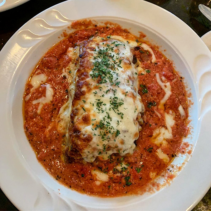 Layers of eggplant and cheese create a vegetarian symphony that even carnivores can't resist.