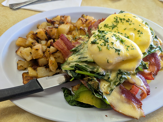Eggs Benedict: where hollandaise dreams come true. This plate doesn't just feed your hunger—it feeds your soul with perfectly poached eggs and that silky sauce.
