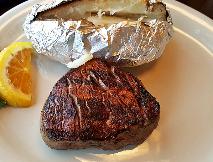 This filet mignon doesn't need a fancy introduction&mdash;it commands respect with its perfect char marks and that foil-wrapped potato standing guard nearby.