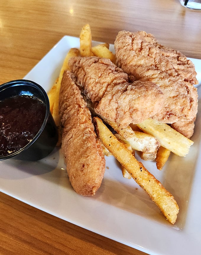 Golden-battered chicken tenders that make you question why you ever grew up. Comfort food that speaks the universal language of "mmmmm."