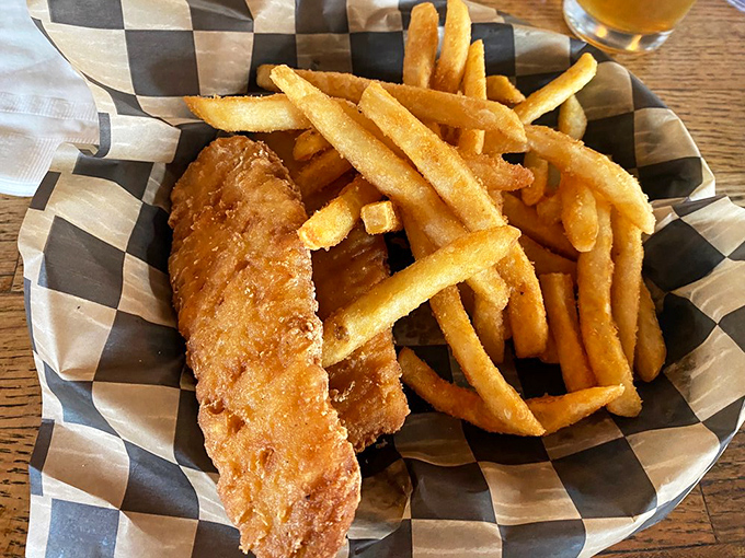 Fish and chips that would make a British pub jealous. Golden, crispy batter protecting flaky white fish&mdash;a perfect marriage of crunch and tenderness.
