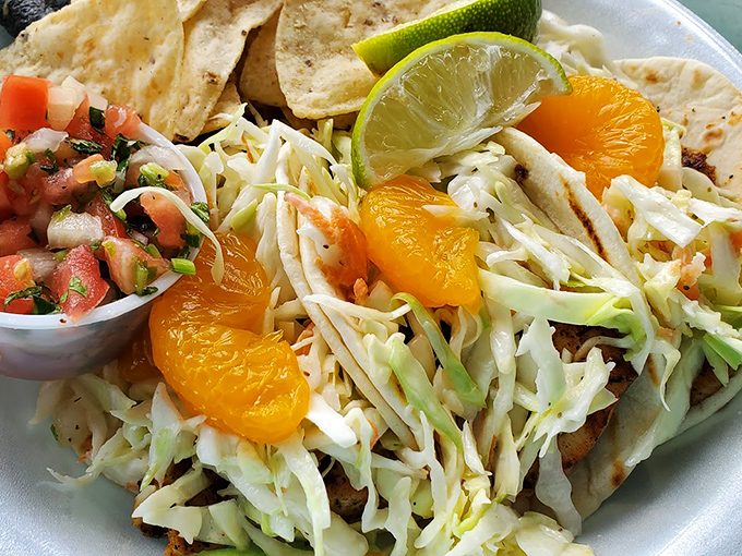These fish tacos don't need fancy presentation – the fresh cabbage slaw, citrus, and perfectly cooked fish speak a universal language of deliciousness.