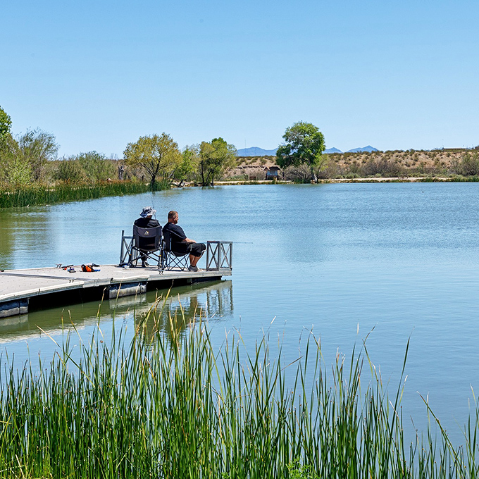 The art of patience – a lone angler creates the perfect postcard moment. Some call it fishing; others call it meditation with occasional interruptions from fish.