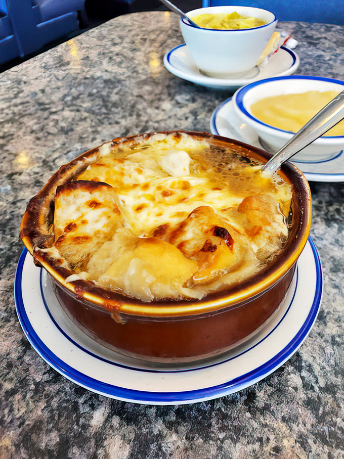 French onion soup that's having an identity crisis as a cheese delivery system. That golden, bubbling top is what winter afternoons were made for.