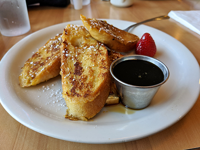 French toast that's achieved the impossible balance&mdash;crispy edges, custardy center, and just enough powdered sugar to make you feel like royalty.
