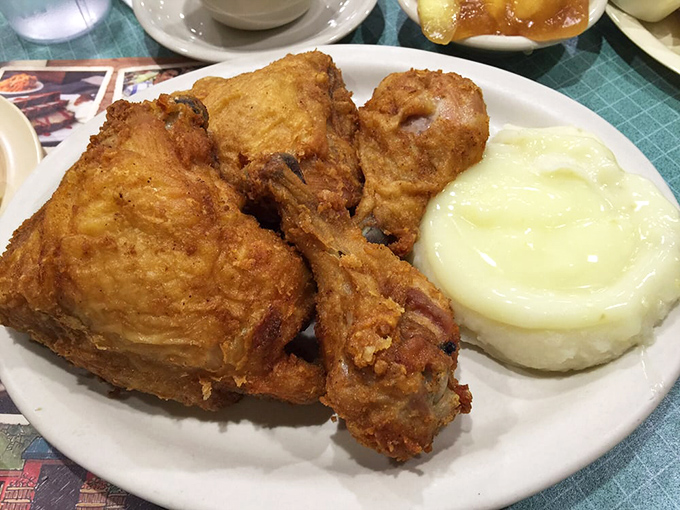 Fried chicken that would make Colonel Sanders question his life choices. Crispy, juicy, and paired with mashed potatoes so creamy they deserve their own fan club.