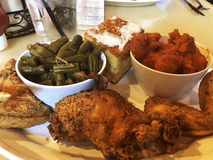 Golden-brown fried chicken that crackles with each bite, alongside green beans and cornbread that make you question why you ever eat anything else.