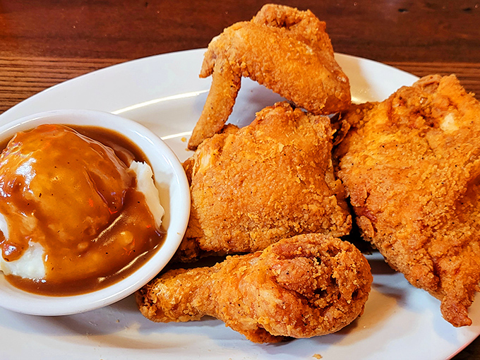 Fried chicken that renders conversation impossible except for appreciative mumbles. That golden crust is the food equivalent of winning the lottery.