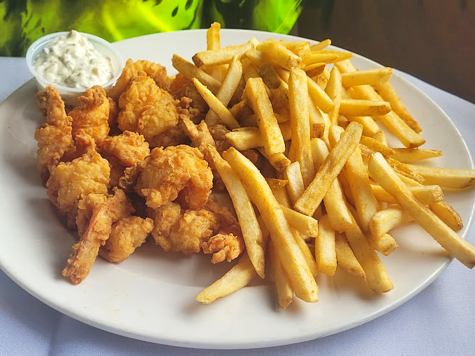 Golden-fried shrimp with a crunch that echoes through the room. The kind of comfort food that makes you want to hug the chef.