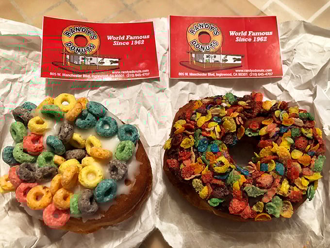 Fruit Loops and Fruity Pebbles found their true calling as donut toppings. Childhood breakfast meets grown-up indulgence in technicolor glory.