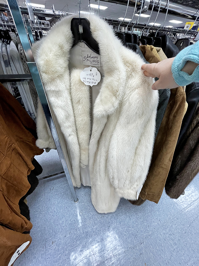 Vintage fur coats hanging like glamorous ghosts from when wearing mink to the grocery store was perfectly acceptable.