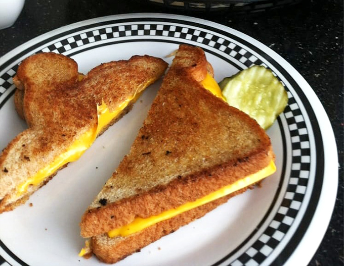 The humble grilled cheese, elevated to art form. That golden-brown exterior gives way to a molten center that would make Elvis swoon.