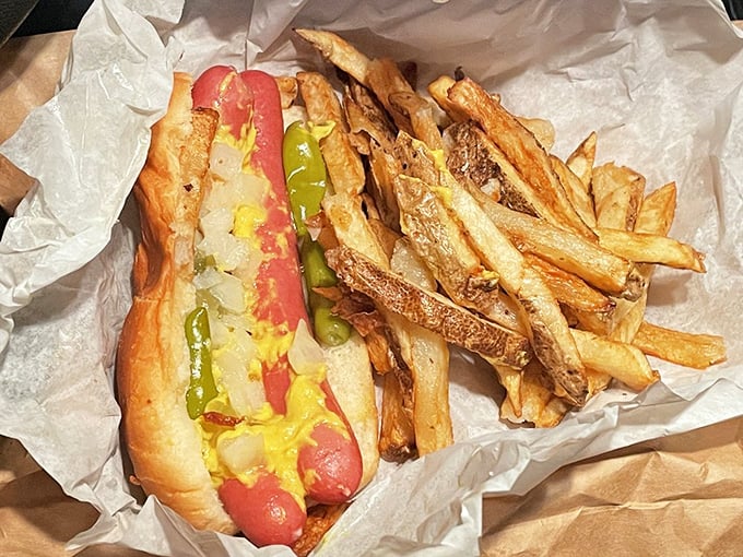 Chicago's edible architecture: a perfectly dressed hot dog with fries piled on top, the way the hot dog gods intended.