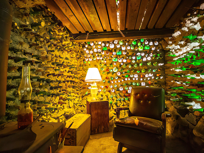 The bottle wall room glows like a stained-glass cathedral for recyclers. Thousands of glass bottles transform ordinary light into an extraordinary experience.