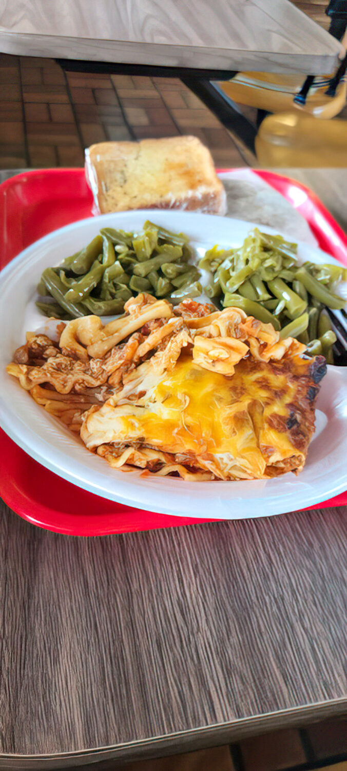 Comfort on a plate: Melted cheese blankets hearty lasagna alongside crisp green beans. Grandma would approve&mdash;and maybe be a little jealous.