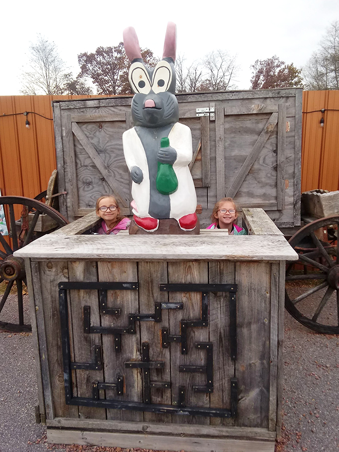 Two young explorers flank a giant lab rabbit statue, proving that Wisconsin Dells' version of "Who Framed Roger Rabbit" takes scientific liberties.