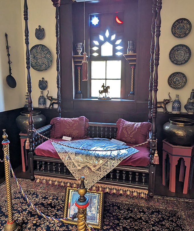 A daybed fit for daydreaming. This ornate resting spot surrounded by decorative plates and tapestries whispers tales from distant bazaars.