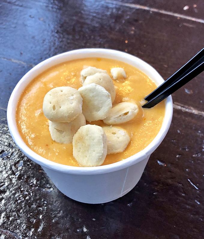 The lobster bisque arrives like a warm hug in a cup, with those oyster crackers playing the perfect supporting role.