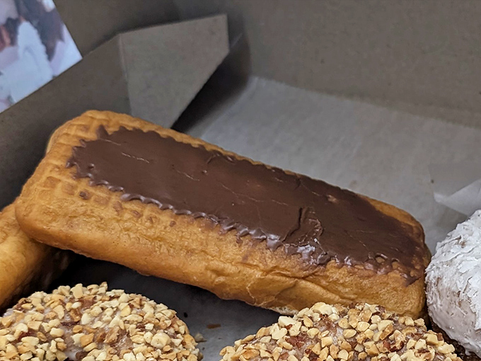 The chocolate long john &ndash; half dessert, half religious experience &ndash; sits alongside its nutty companions like edible works of art.