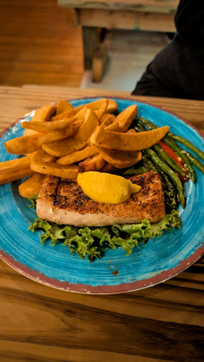 Fresh mahi mahi arrives golden and flaky, proving that sometimes the simplest preparations create the most memorable meals.