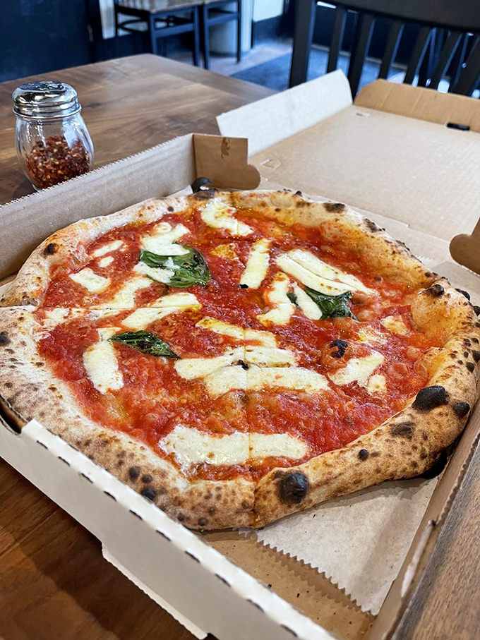 The Margherita pizza in its purest form&mdash;San Marzano tomatoes, fresh mozzarella, basil, and that incredible wood-fired crust. Simplicity perfected.