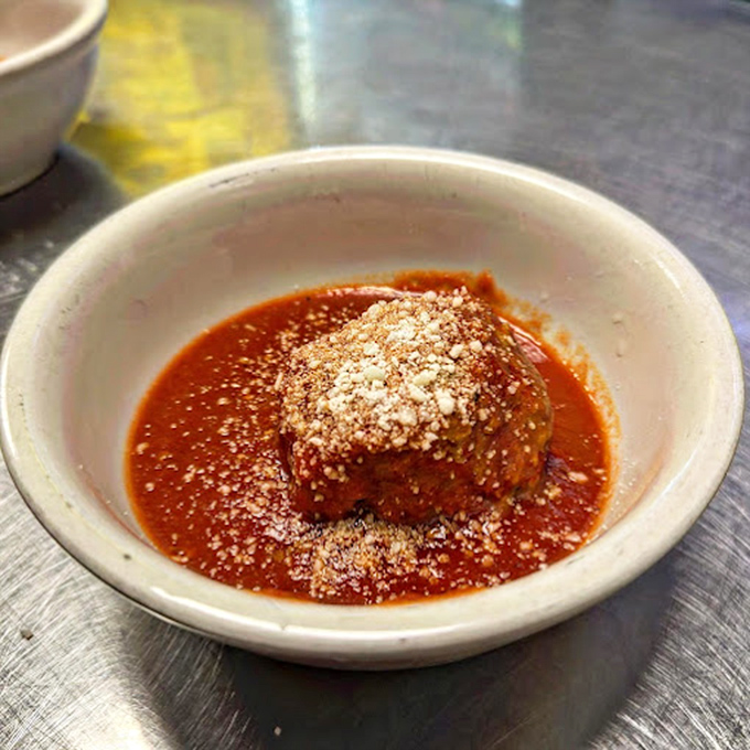 A single meatball swimming in that signature red sauce&mdash;like a tiny planet orbiting a delicious sun&mdash;waiting to become the center of your universe.