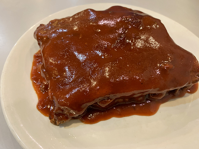 This isn't just meatloaf &ndash; it's a saucy slab of nostalgia that would make your grandmother simultaneously proud and jealous of their recipe.