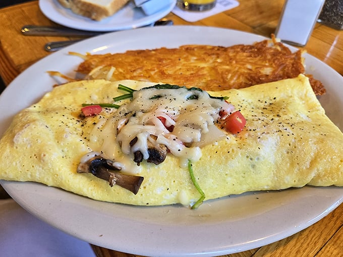 An omelet so generously stuffed, it's practically doing yoga poses to keep everything inside.