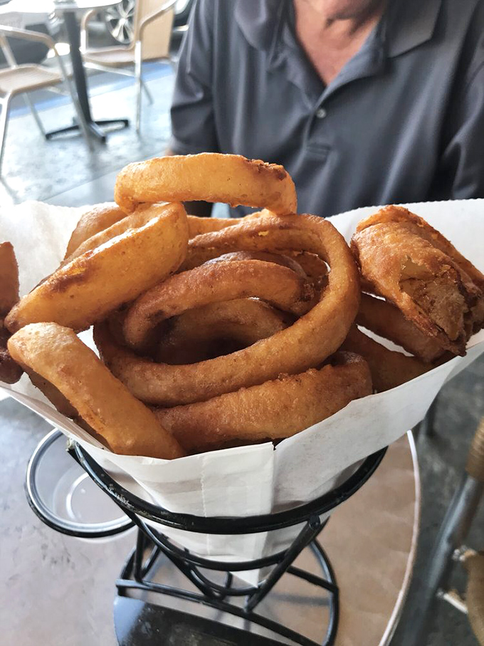 Golden rings of happiness that crunch like a satisfying plot twist. These aren't just onion rings&mdash;they're edible jewelry for your taste buds.