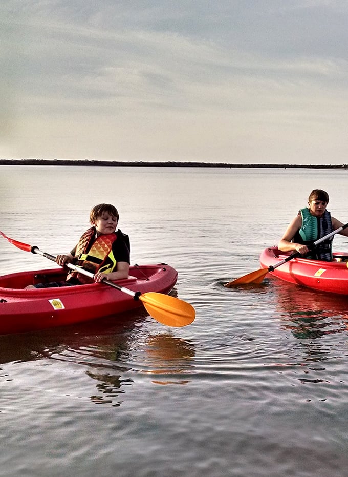Childhood summer memories in the making. These young paddlers are discovering the joy of kayaking on Lake Erie's calm waters at sunset.