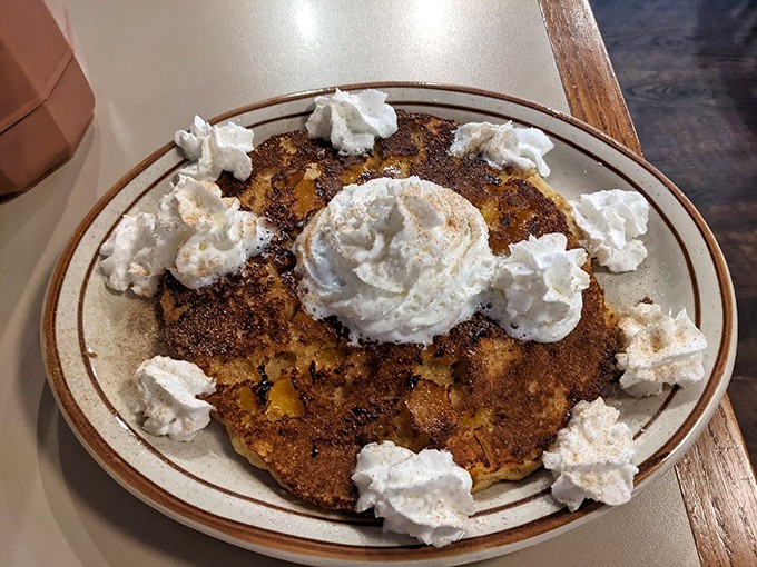Pancake perfection crowned with whipped cream. Like a breakfast carnival that somehow passes as a legitimate morning meal.