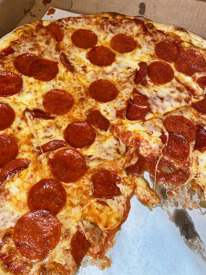 Pepperoni that curls into little flavor cups, holding tiny pools of savory goodness. This is pizza engineering at its finest.