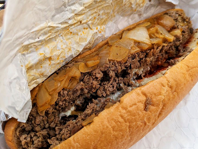 Behold the star of the show! Thinly chopped ribeye and caramelized onions nestled in a perfect roll &ndash; this is Philadelphia in sandwich form.
