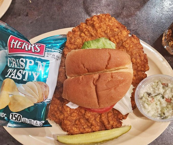 That pork tenderloin is bigger than your head and twice as satisfying &ndash; Midwest comfort on a bun.